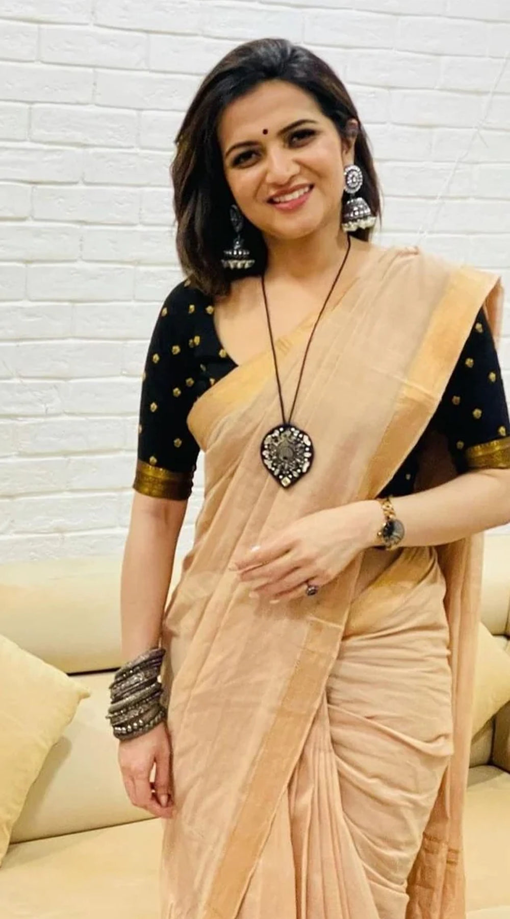 Beige & Black Saree: Striking Fashion At Thenmozhi Designs